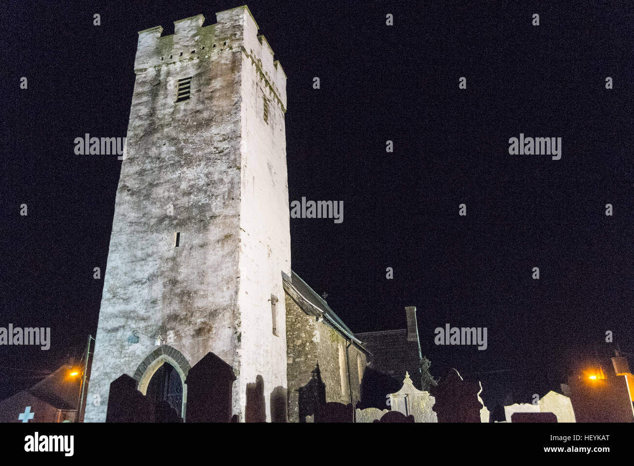 Floodlit, lit up Llansaint church in centre of Llansaint village. A ...
