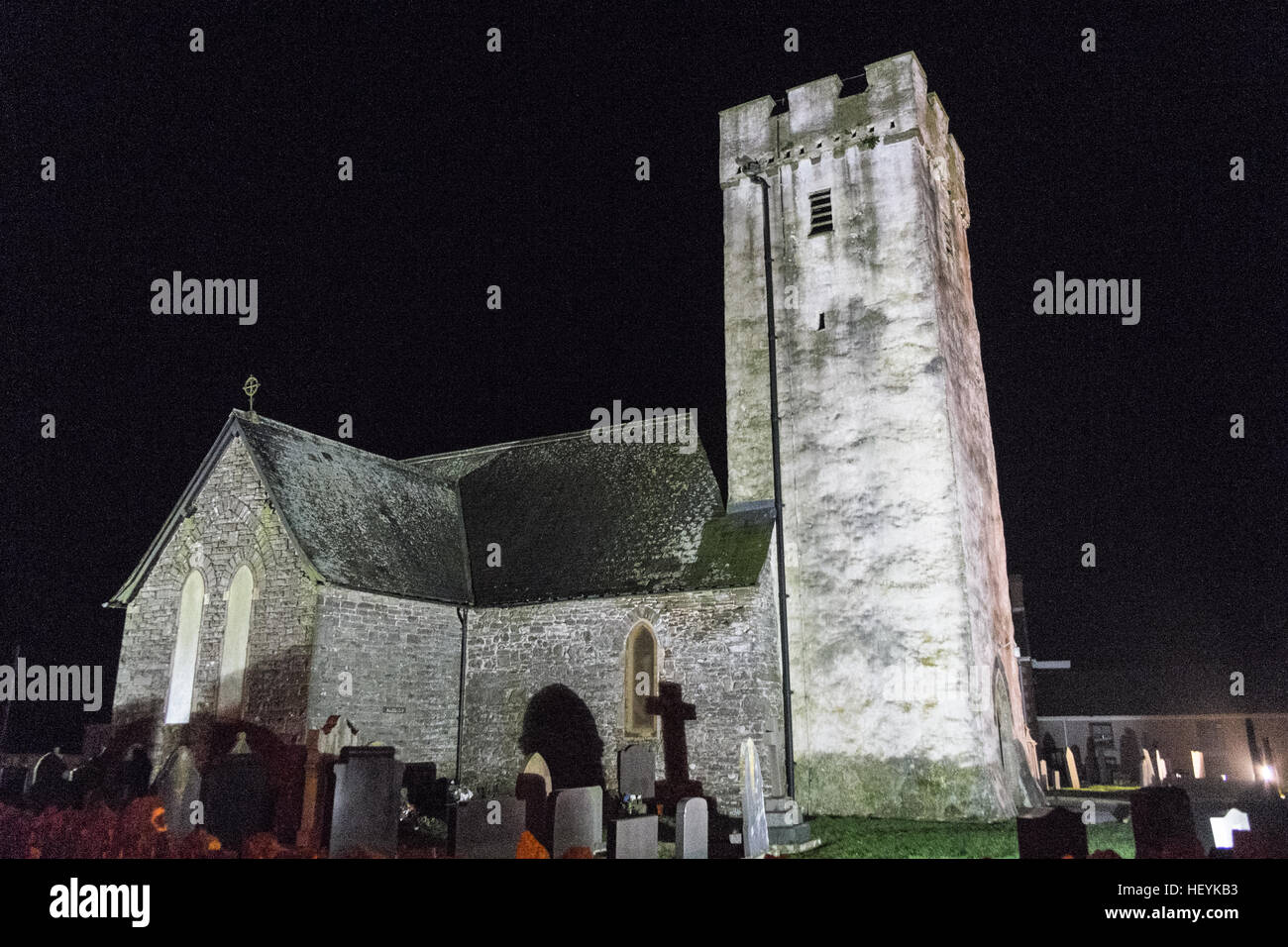 Floodlit, lit up Llansaint church in centre of Llansaint village. A ...