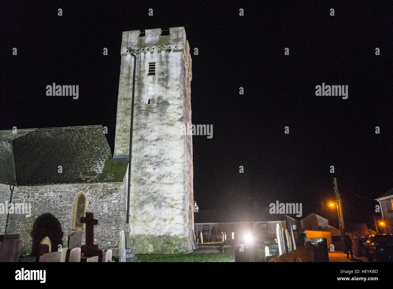 Floodlit, lit up Llansaint church in centre of Llansaint village. A ...