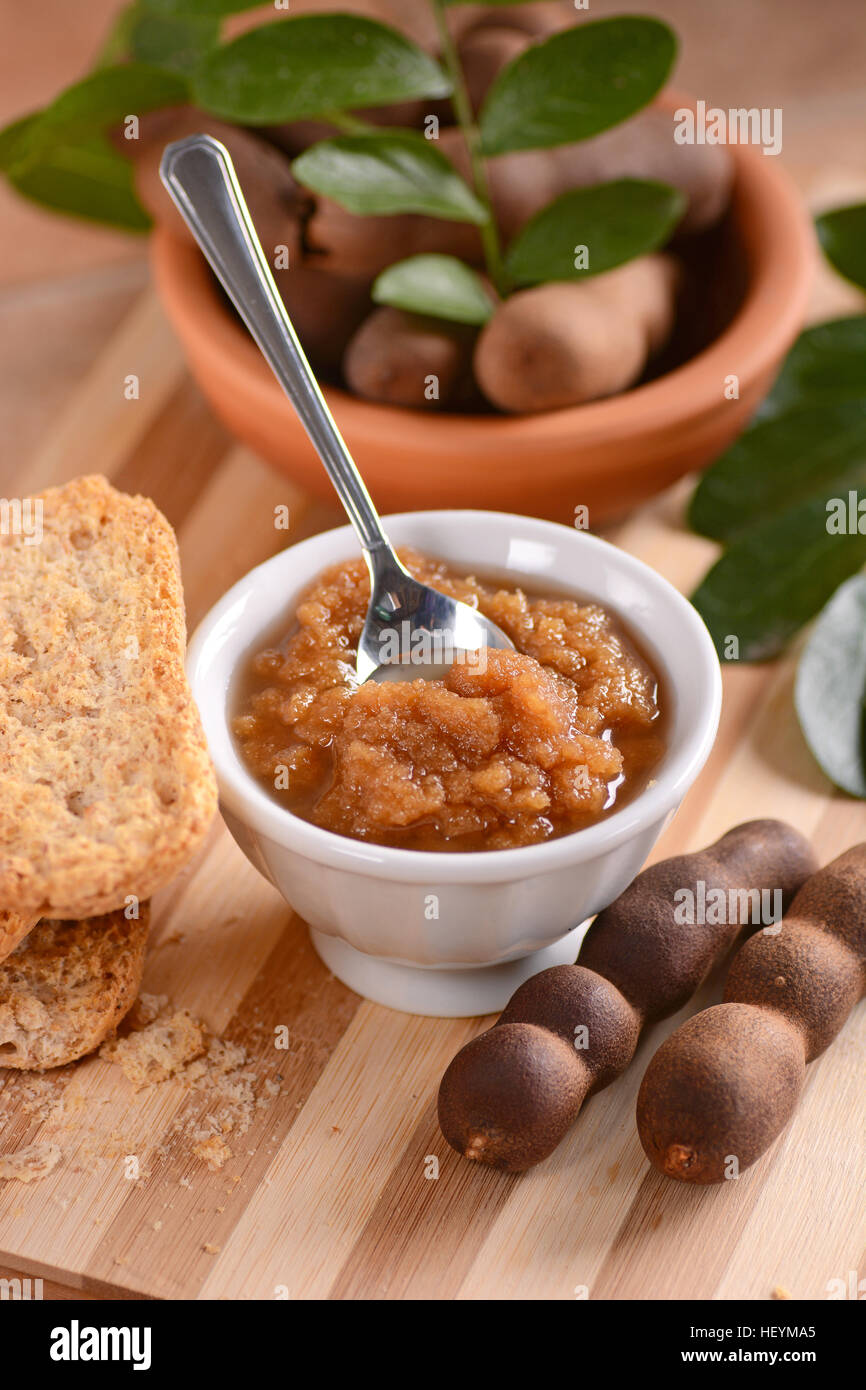 tamarind jam in white bowl with fruits around Stock Photo - Alamy