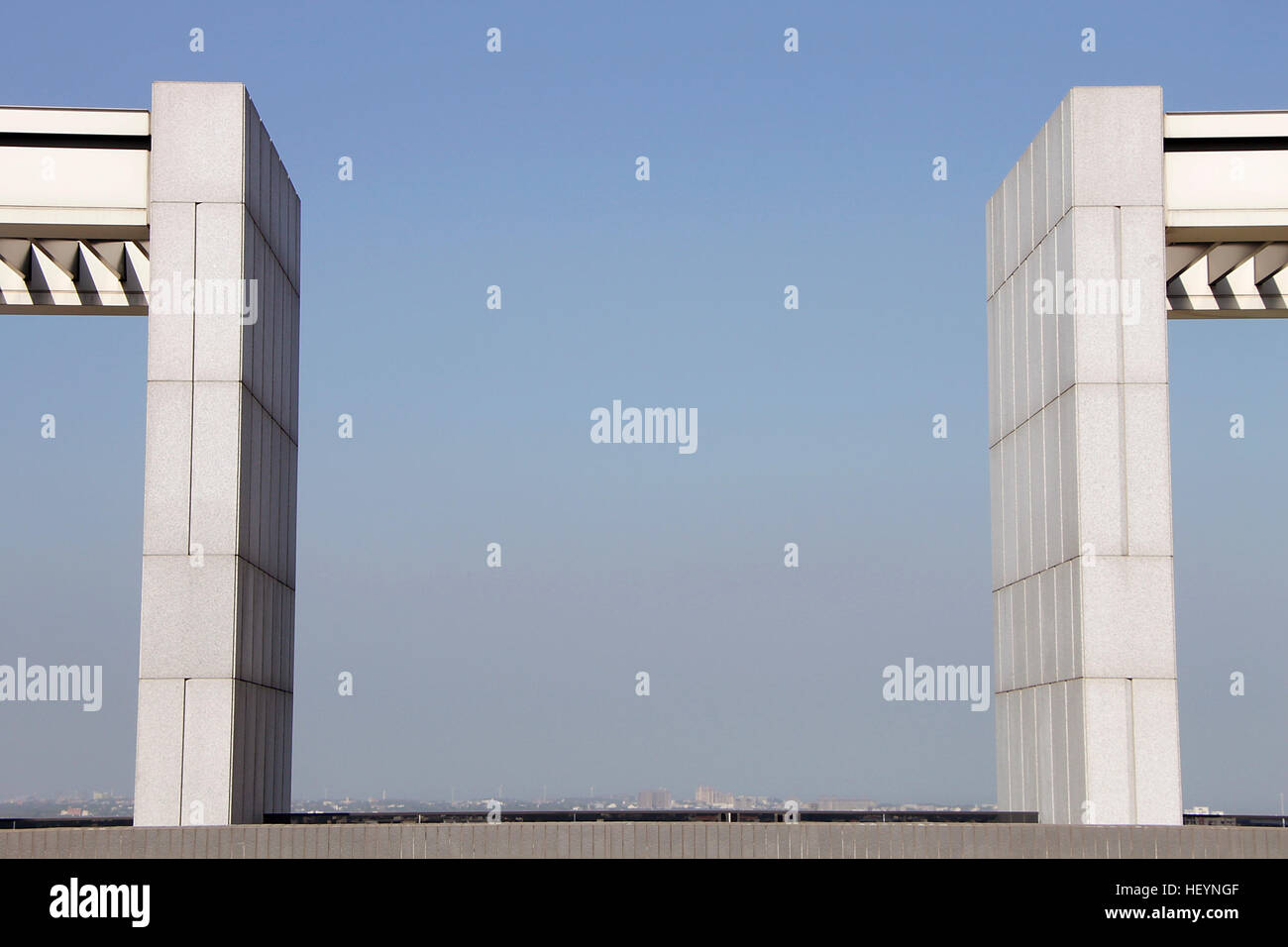 Looking between two arches of a building Stock Photo - Alamy