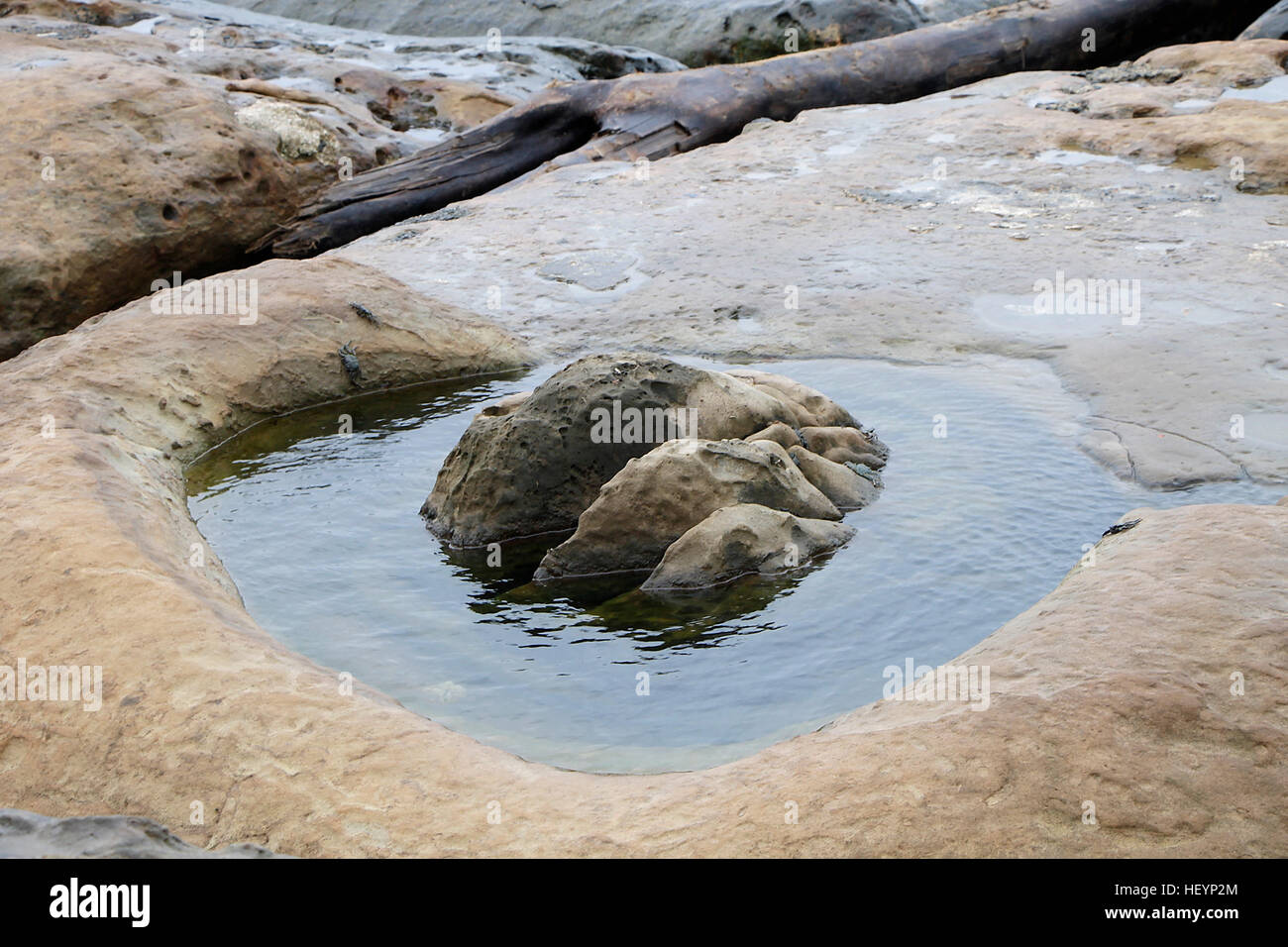 Unusual rock formation in pool of water Stock Photo - Alamy