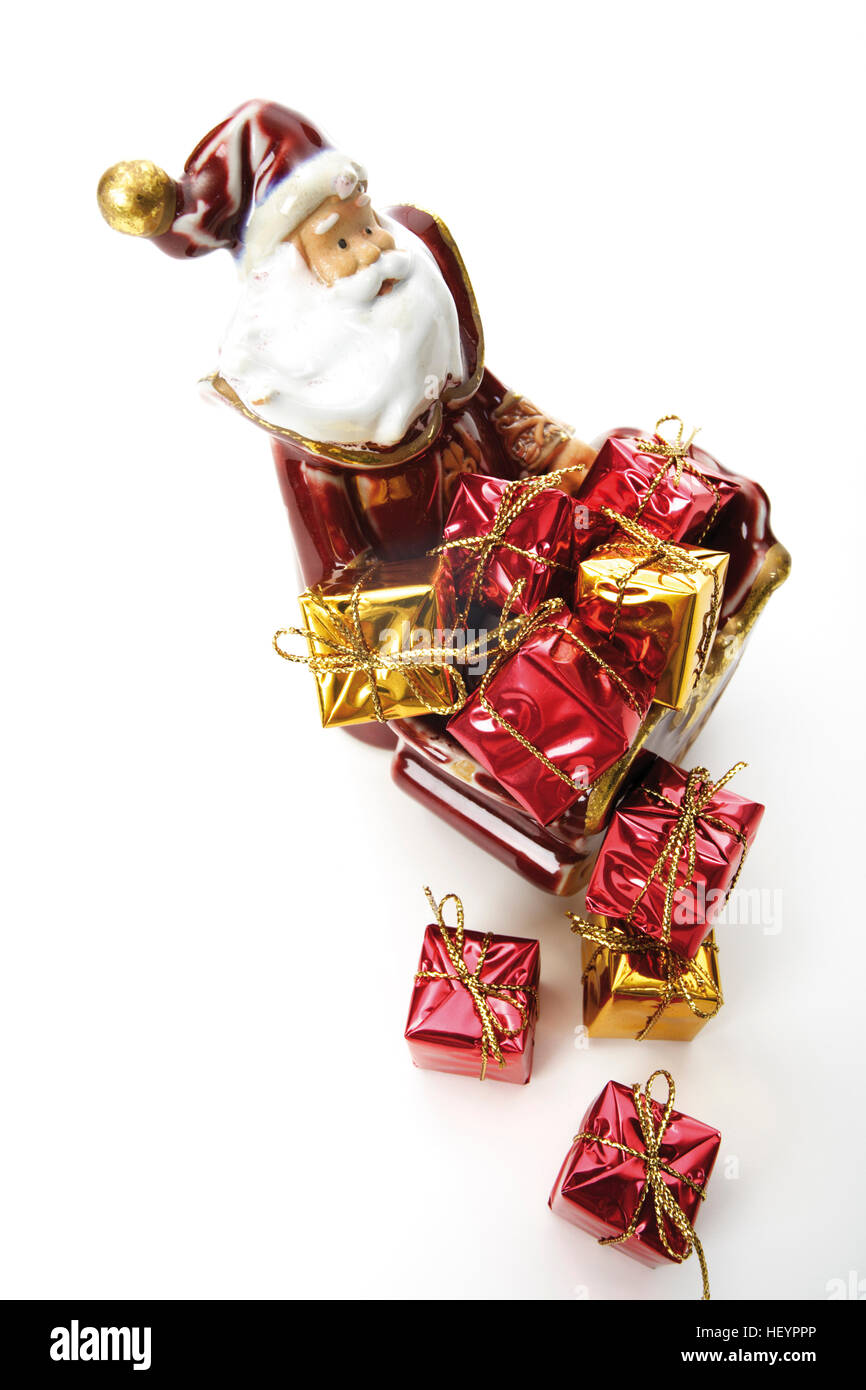 Santa Claus delivering small wrapped presents, Christmas decoration ...