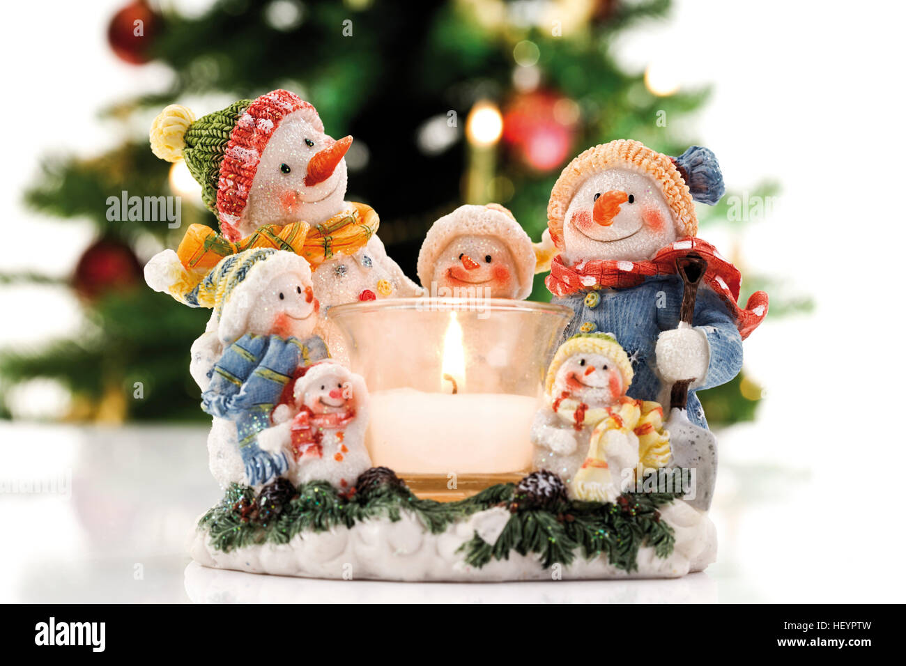 Snowman family tea light holder as Christmas decoration Stock Photo - Alamy