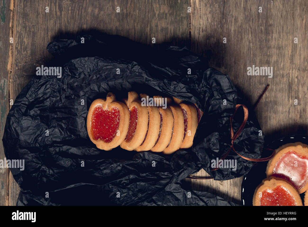 cookies and biscuits on black table background. Afternoon break time ...
