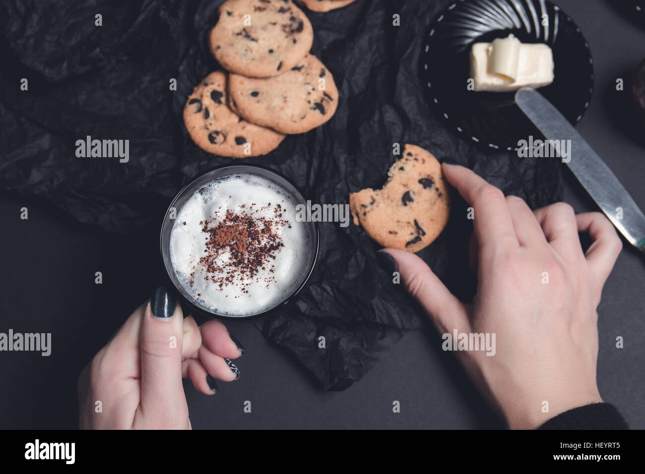 cookies and biscuits on black table background. Afternoon break time ...