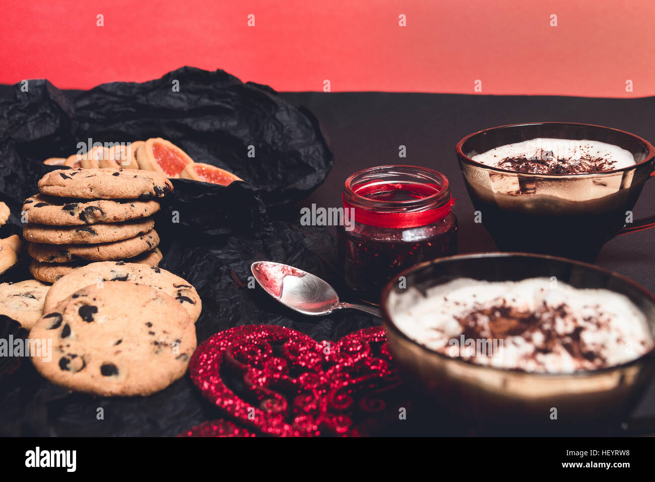 cookies and biscuits on black table background. Afternoon break time ...
