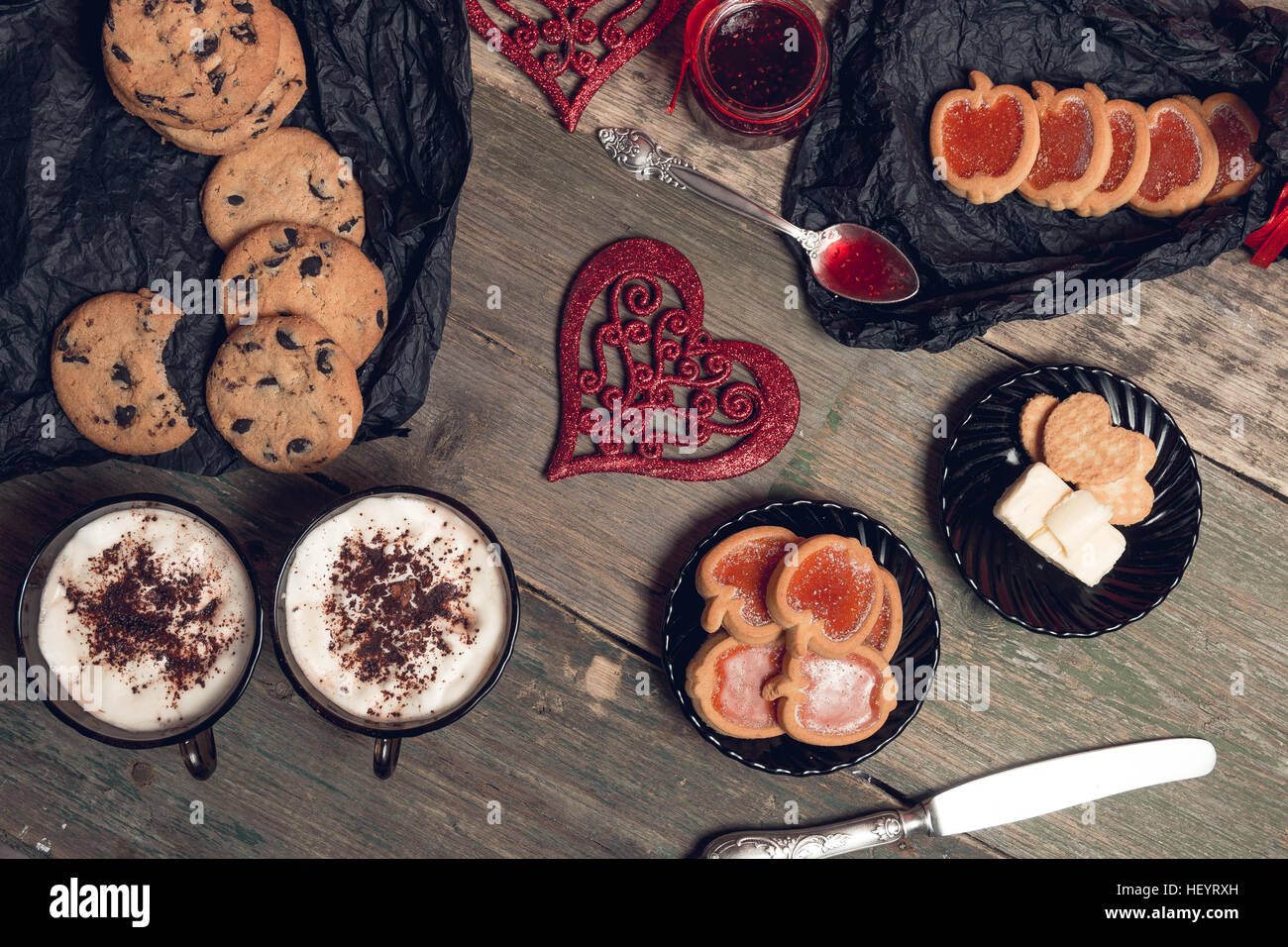 cookies and biscuits on black table background. Afternoon break time ...