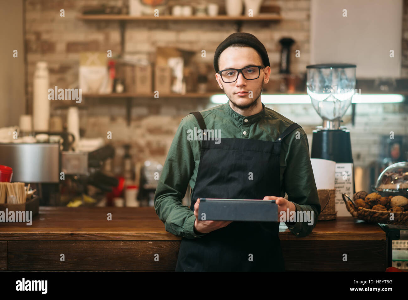 Barman making check in cafe Stock Photo - Alamy