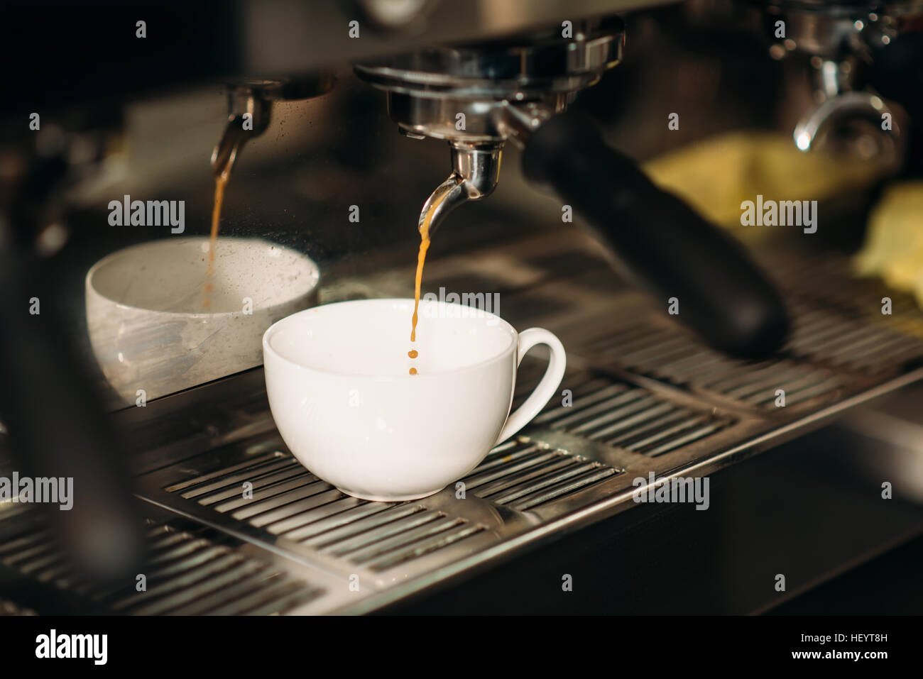 Drink cooking in a coffee machine Stock Photo - Alamy