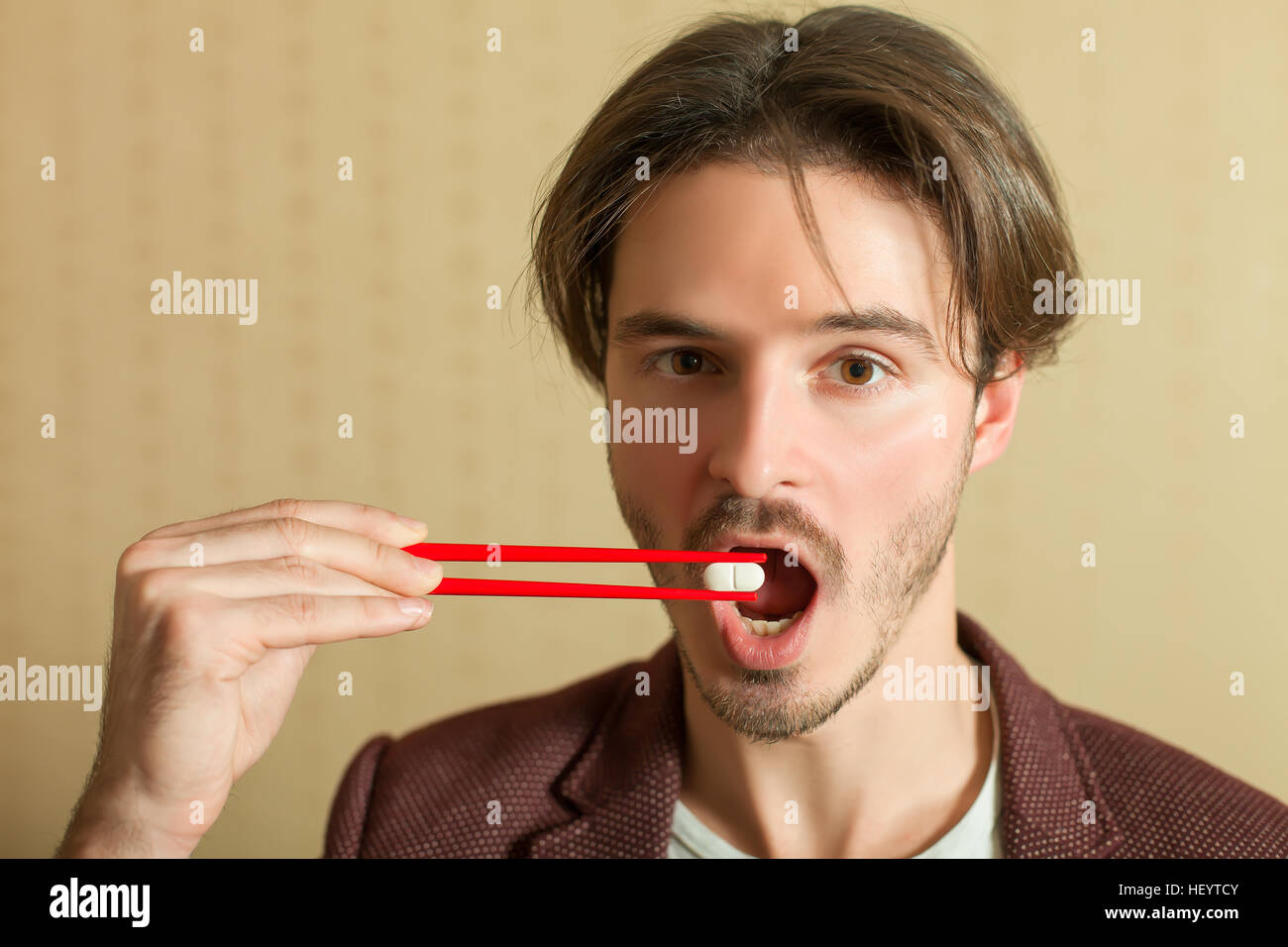 Trying to eat with chopstick hi-res stock photography and images - Alamy