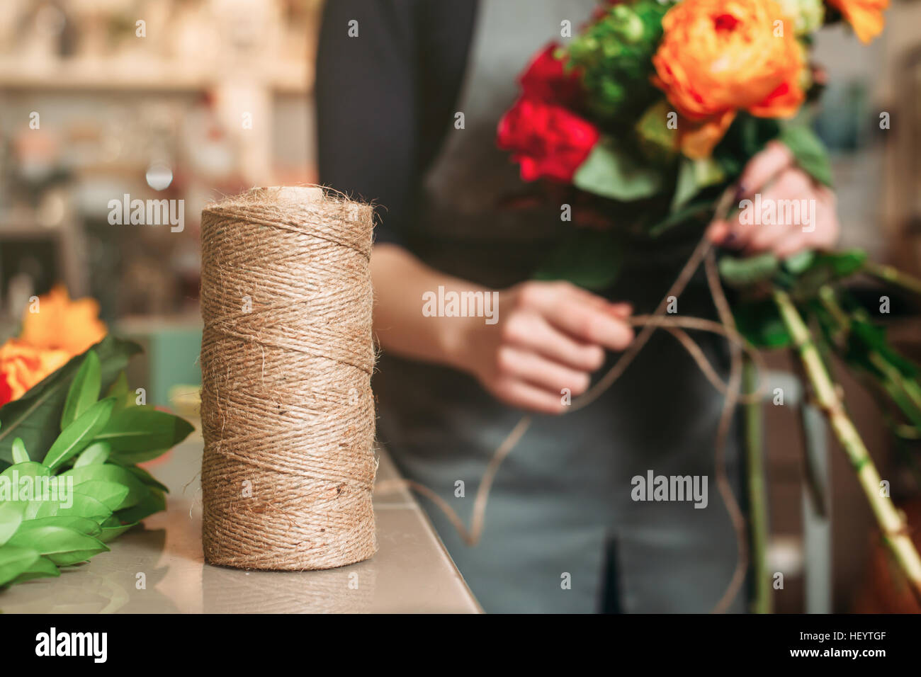 Florist work at flower shop Stock Photo - Alamy