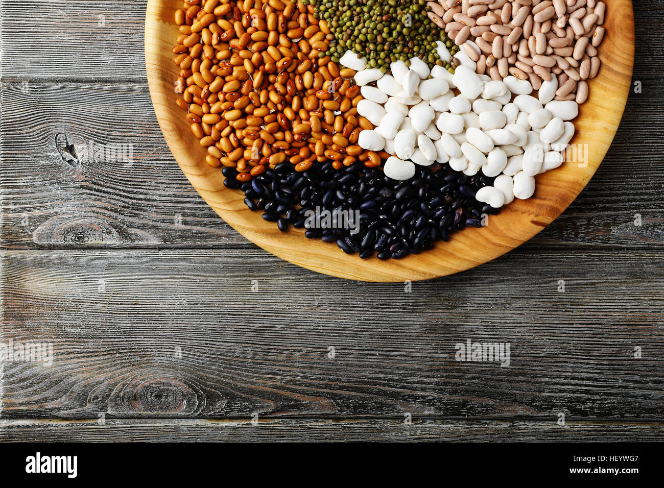 Different color of beans on plate, food top view Stock Photo - Alamy