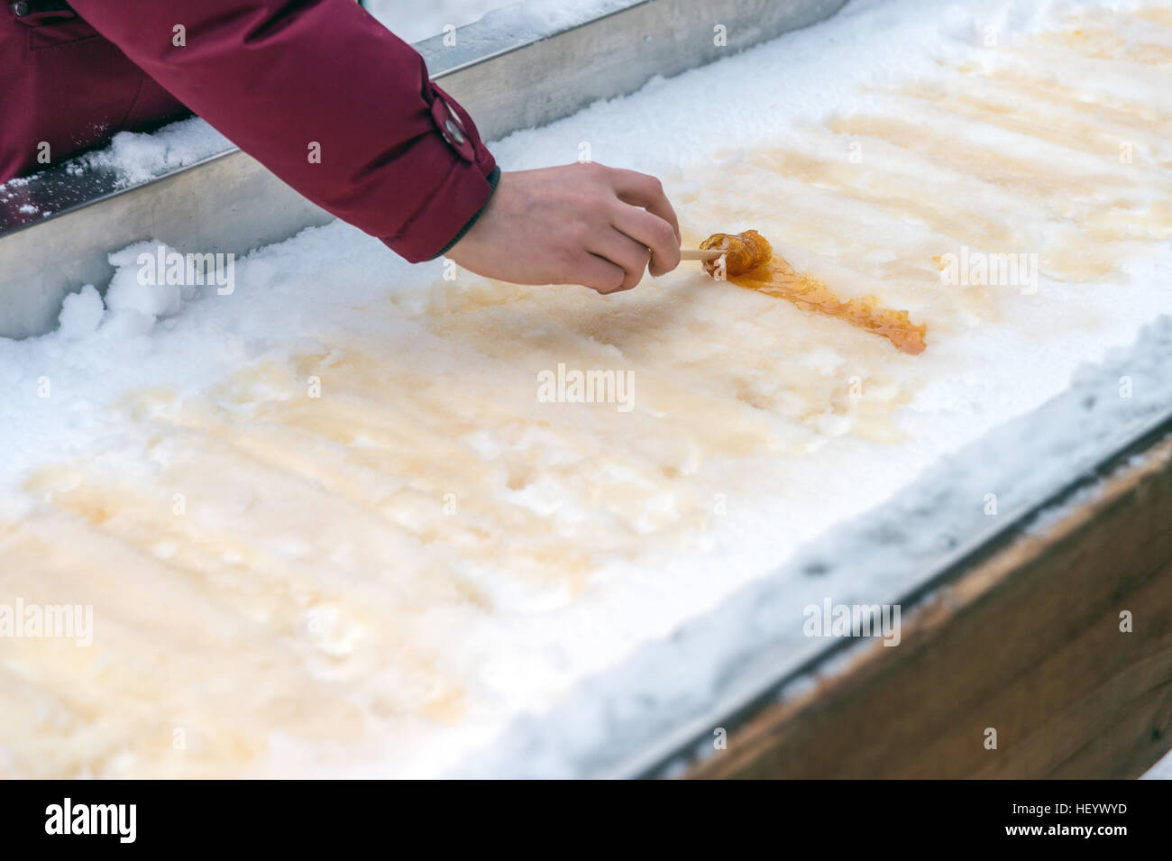 Maple taffy on snow in Montreal, Quebec, Canada Stock Photo - Alamy