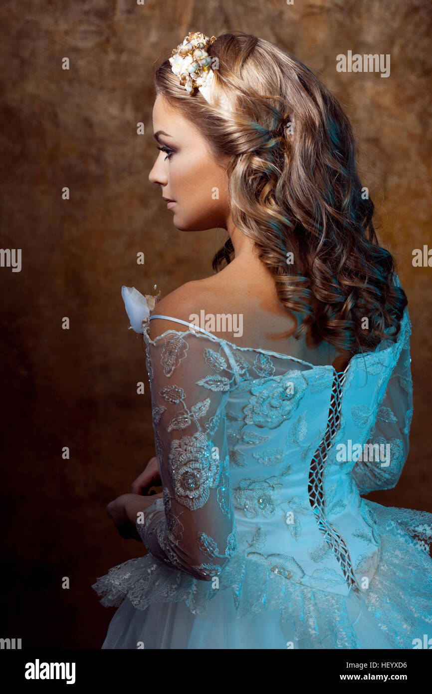 Beautiful girl bride in luxurious wedding dress, portrait in profile ...