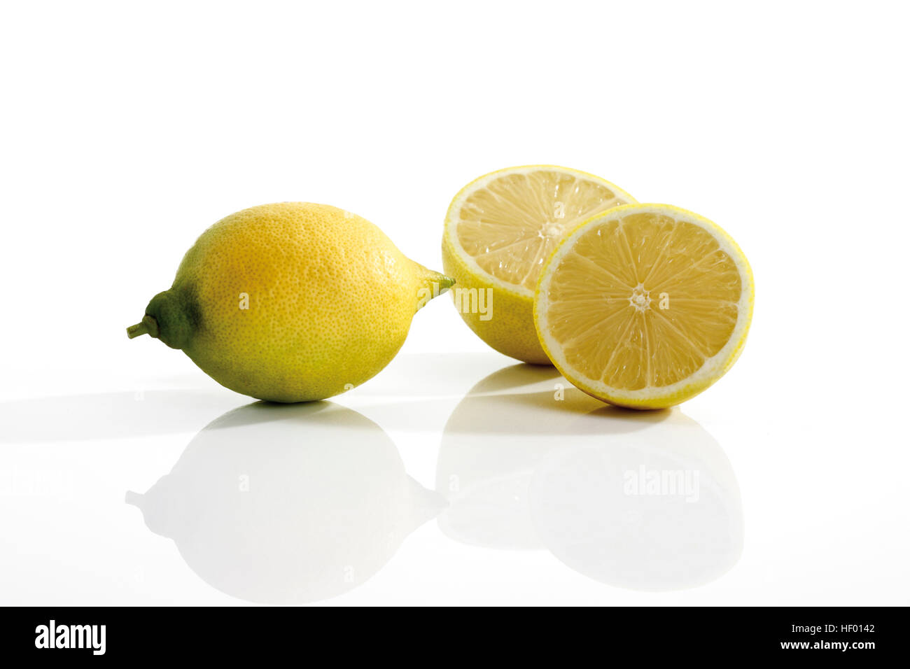 One whole and one halved lemon (Citrus × limon Stock Photo - Alamy