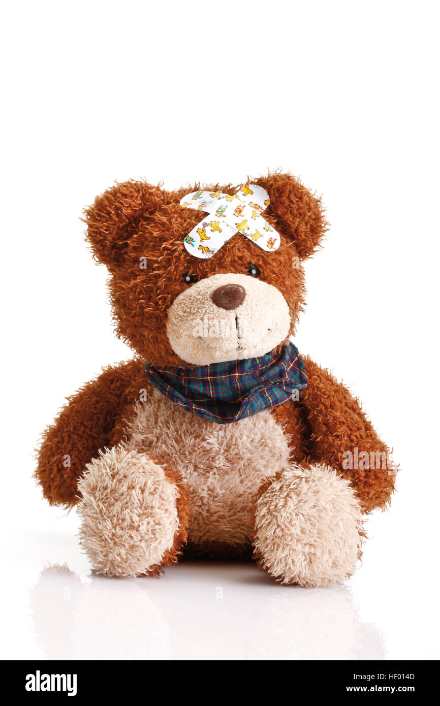 Teddy bear with band-aids on its head Stock Photo - Alamy
