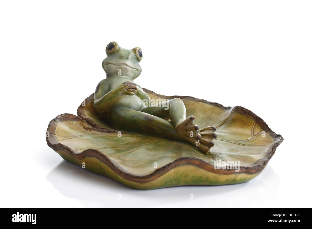 Decor, frog laying back on lotus leaf Stock Photo - Alamy