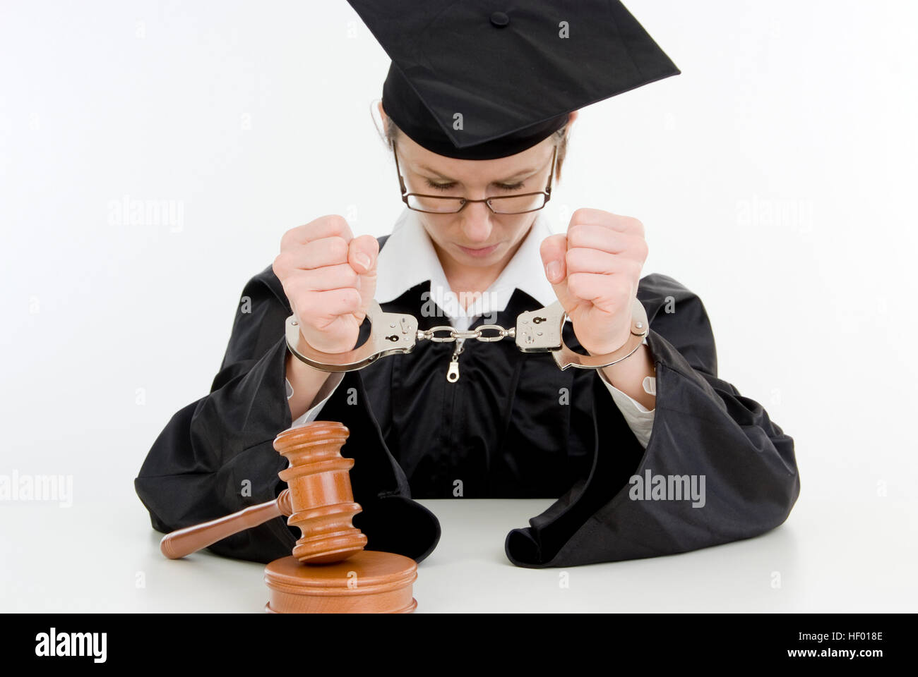 Female judge with handcuffs, "her hands are tied Stock Photo - Alamy