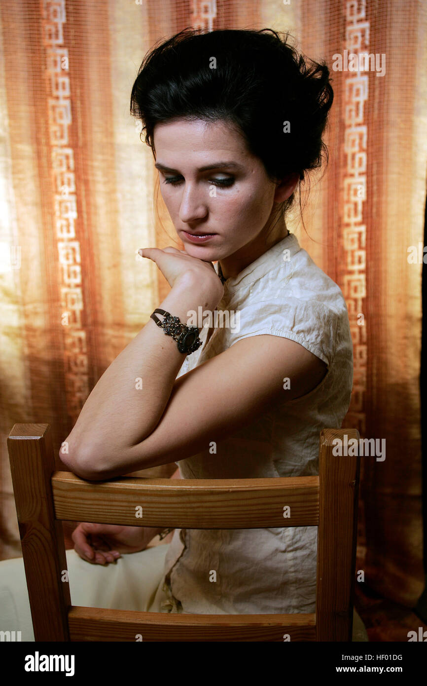 Portrait of a young woman, gaze lowered Stock Photo - Alamy