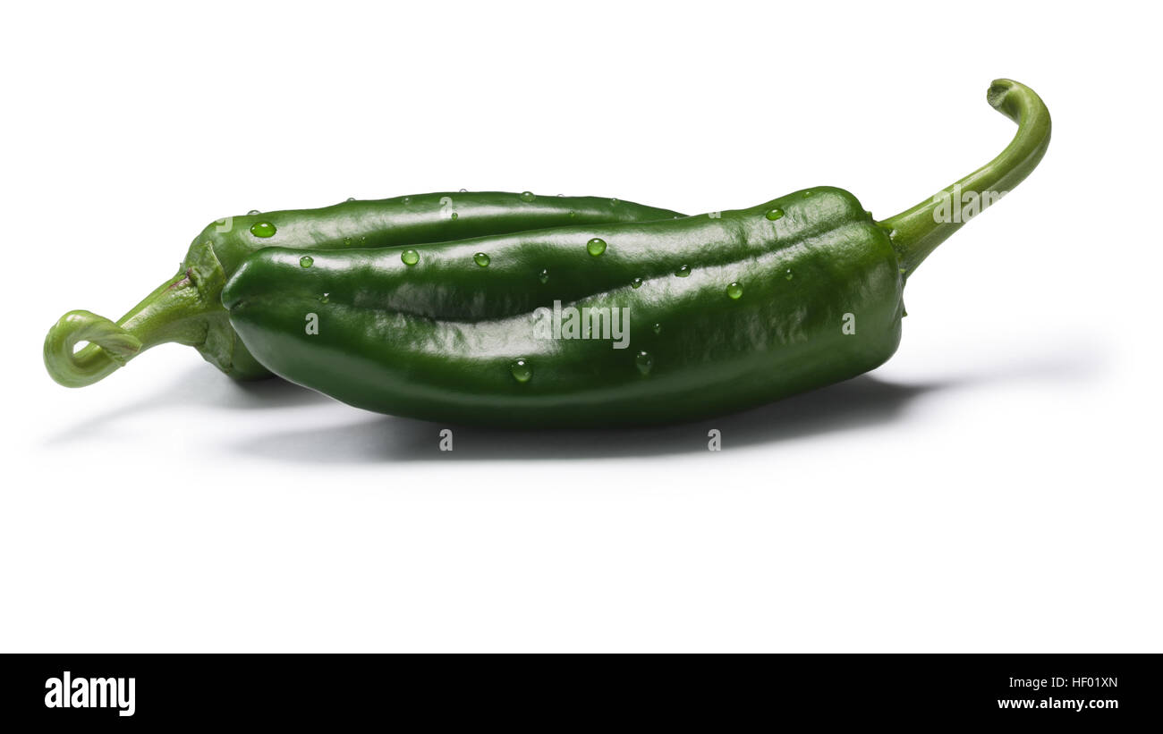 Two Green whole Anaheim peppers (Capsicum annuum), the mild variety of ...
