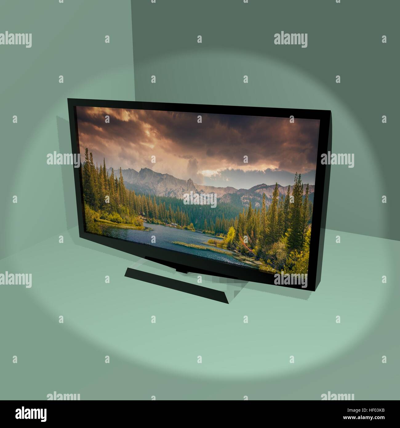 LED TV in a room illuminated by a spot lamp, it displays a landscape ...