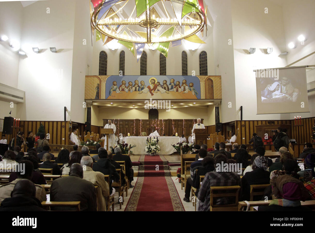 Cairo, Egypt. 24th Dec, 2016. People attend Christmas Eve mass at the All Saints' Cathedral in ...