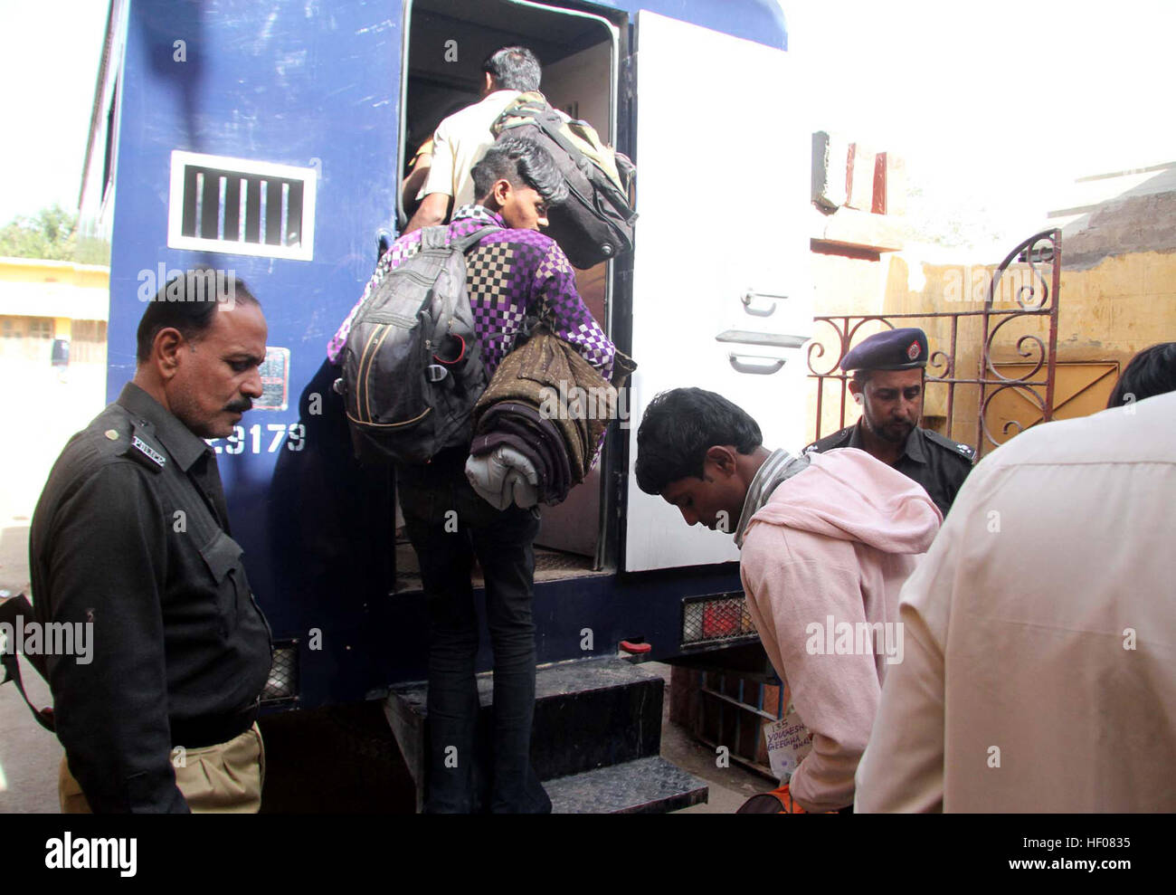 Karachi. 25th Dec, 2016. Released Indian fishermen board a police van ...