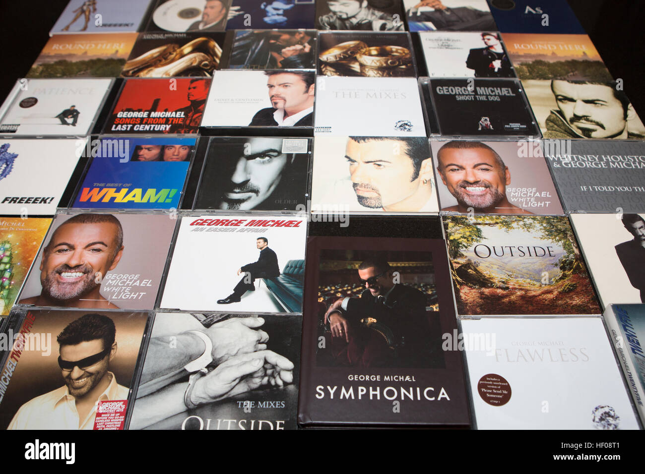 A photograph of a CD collection from George Michael's various music cd ...