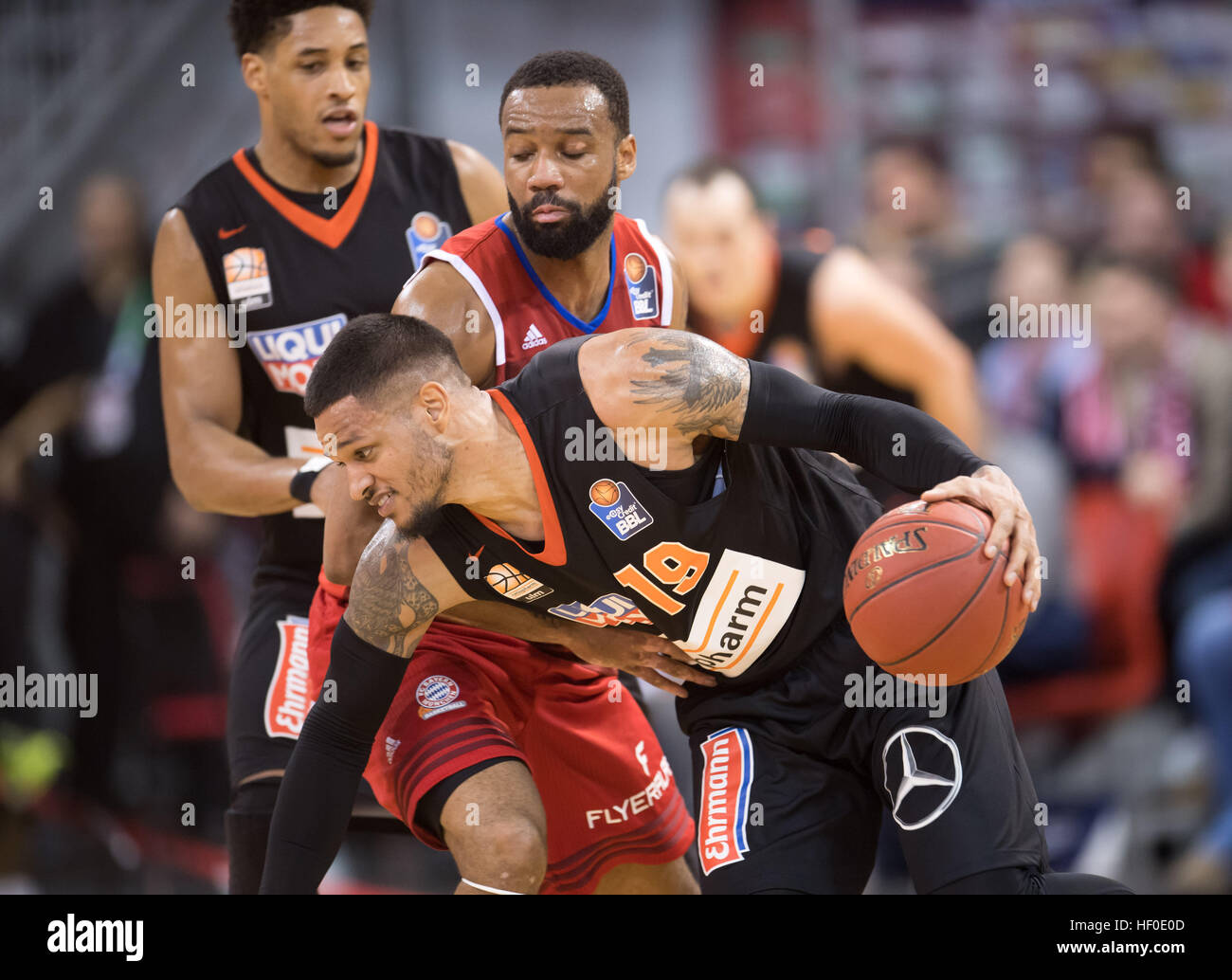 Munich, Germany. 26th Dec, 2016. Chris Babb (FRONT) from Ulm in action ...