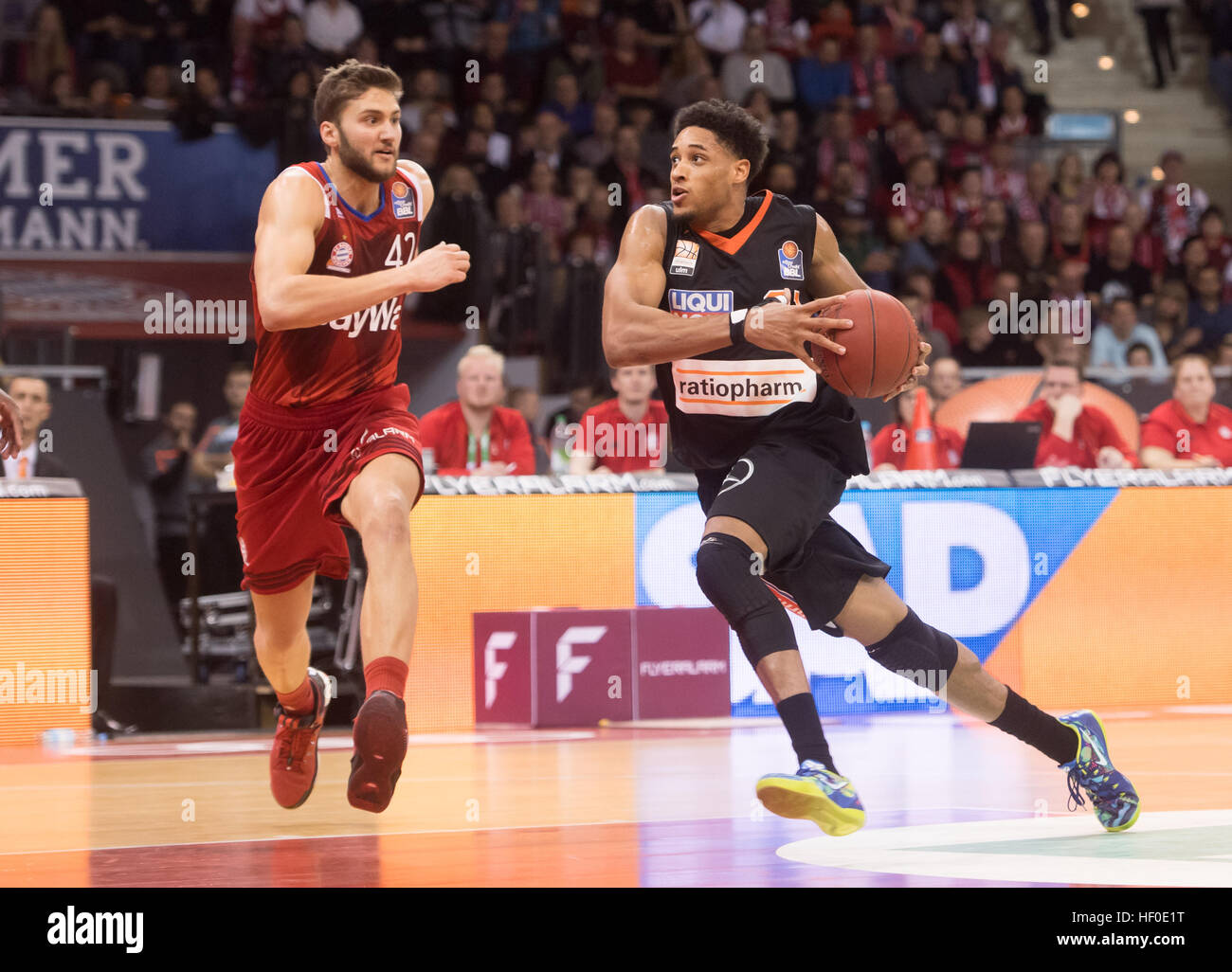 Munich, Germany. 26th Dec, 2016. Augustine Rubit (R) from Ulm and ...