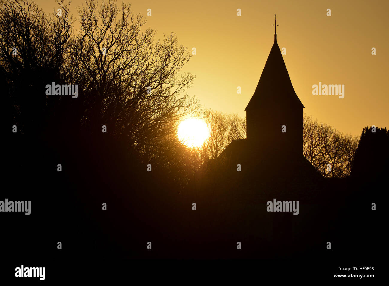 Sunrise behind rural village church Stock Photo - Alamy
