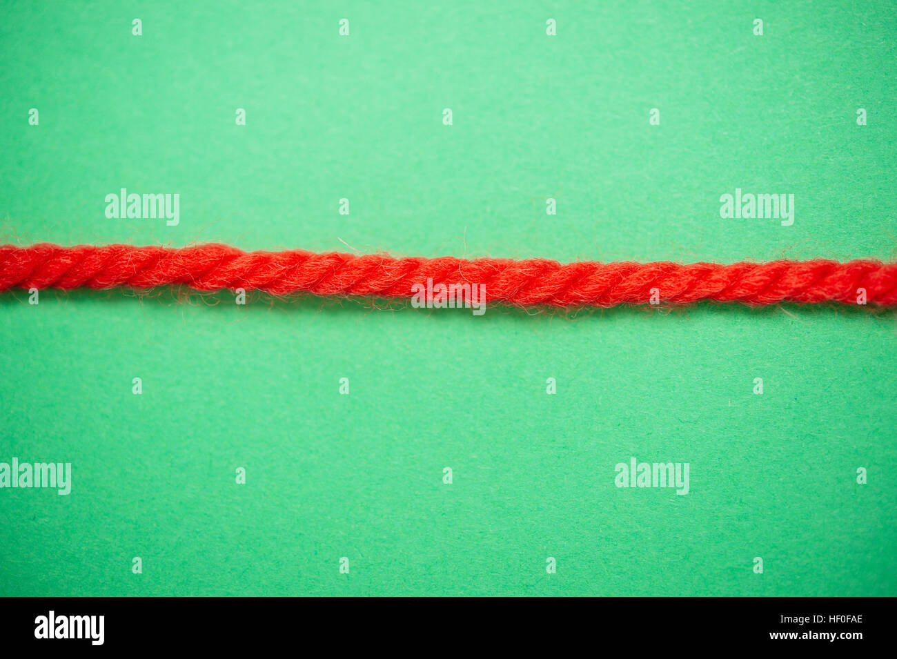Oberursel, Germany. 25th Nov, 2016. Symbolic picture of a red thread ...