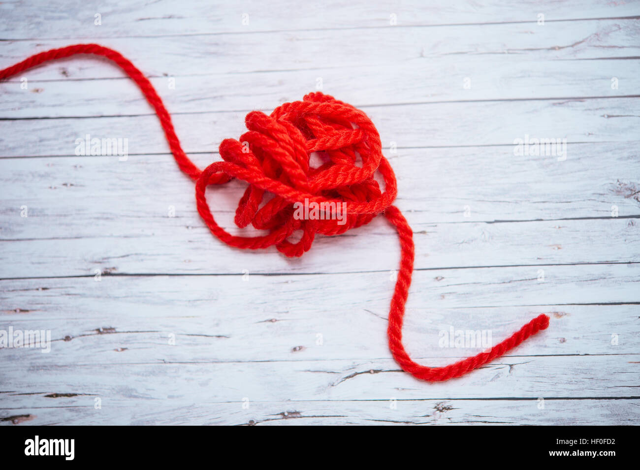 Oberursel, Germany. 25th Nov, 2016. Symbolic picture of a red thread ...