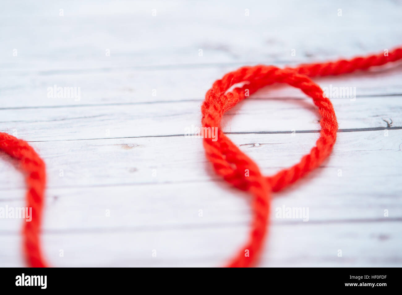 Oberursel, Germany. 25th Nov, 2016. Symbolic picture of a red thread ...