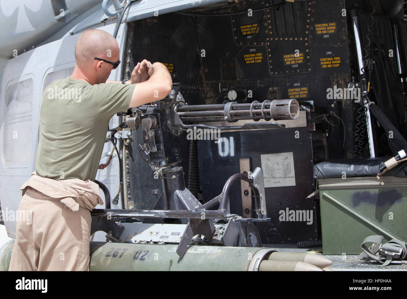 U.S. Marine Corps Sgt. Andrew Morey performs maintenance on the M134 ...