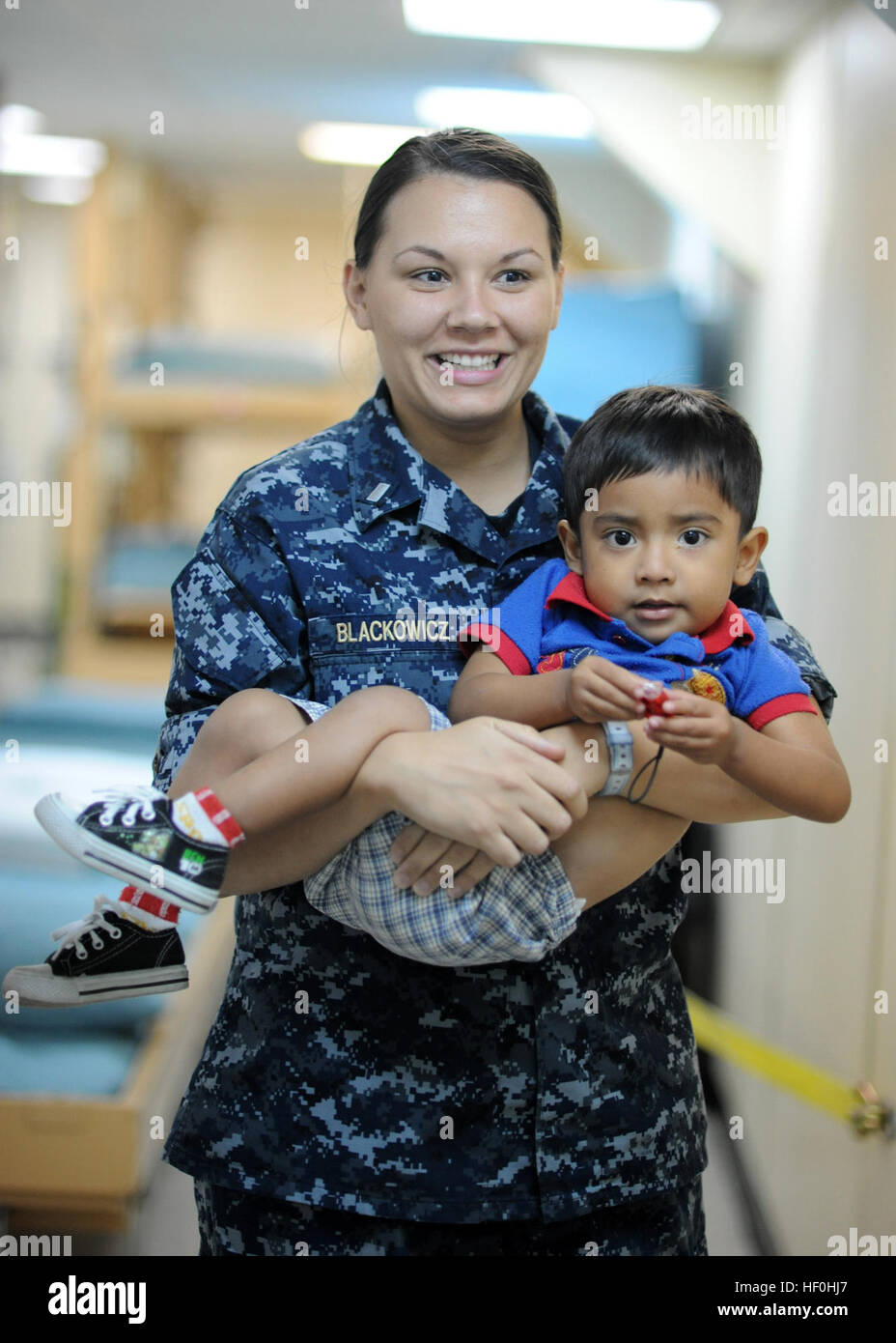 A patient rests in the post-surgery ward aboard the Military Sealift ...