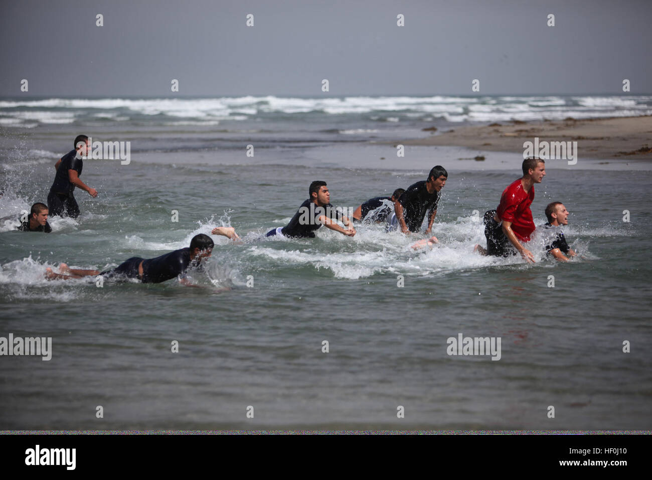 U.S. Marine Corps recruits conduct Marine combat drills in the surf at ...