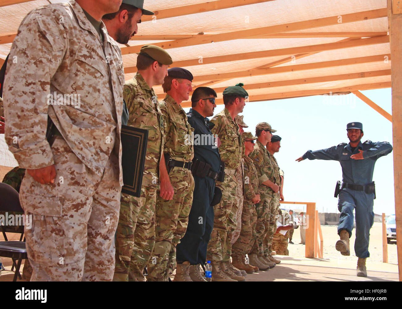 An Afghan Uniformed Policeman marches across the stage at the Joint ...