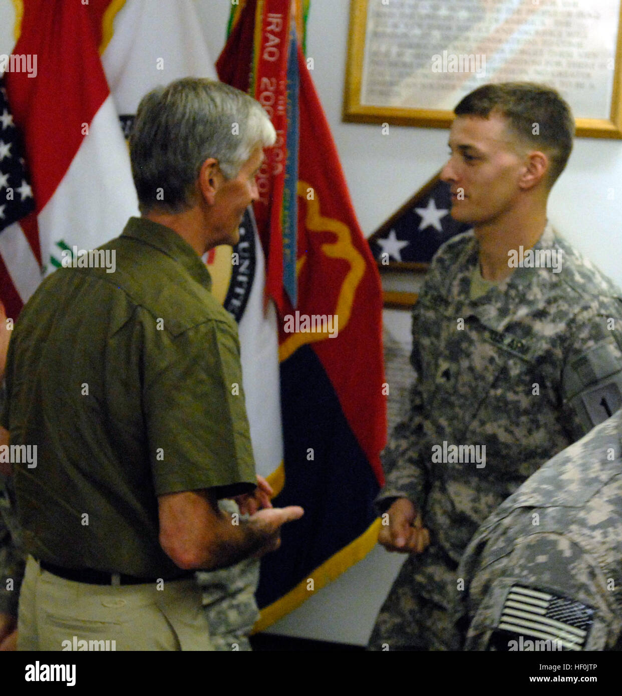 John McHugh (left), Secretary of the Army, speaks with Sgt. Shaun ...