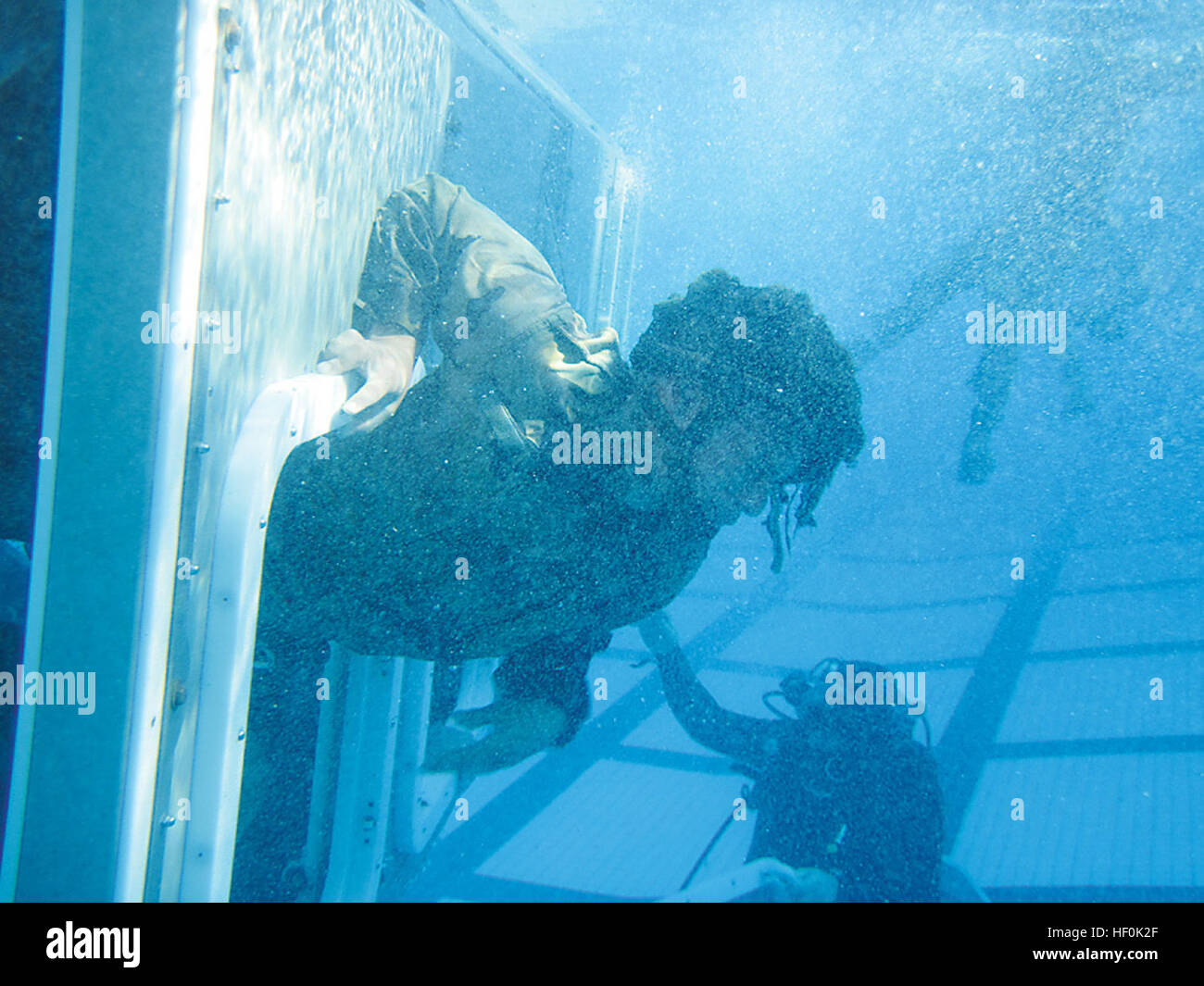 A French airborne marine escapes from the helicopter egress trainer at ...