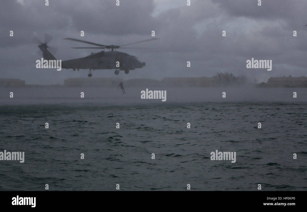 U.S. Navy Aviation Warfare Systems Operator 3 Rachel Robinette drops ...