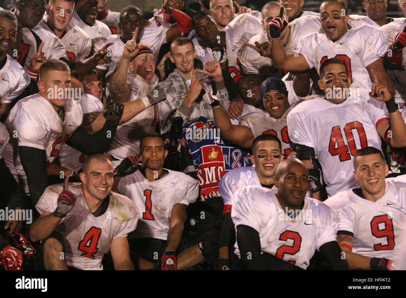 Players from the Miramar Falcons football team celebrate their win at ...
