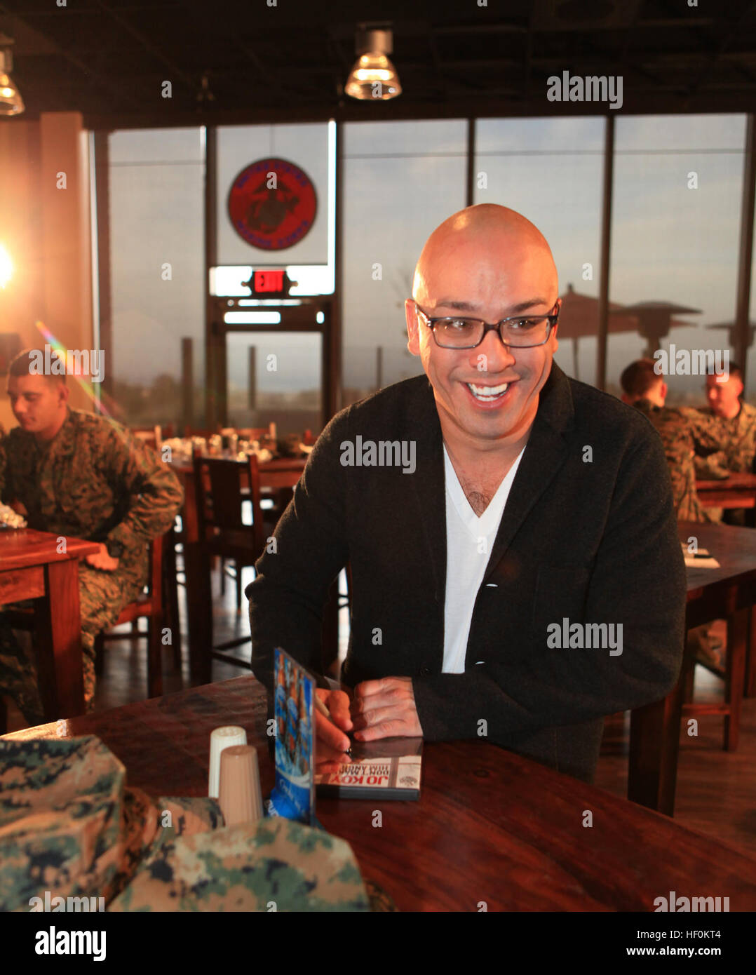 Standup comedian Jo Koy autographs his DVD for a Marine during a pre ...