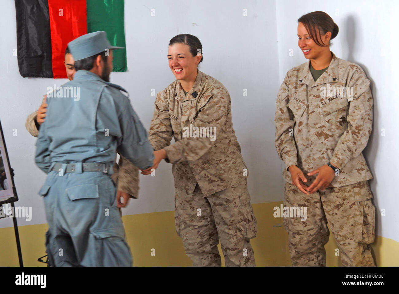 Petty Officer 2nd Class Kimberly Ryan (center), a corpsman and team ...