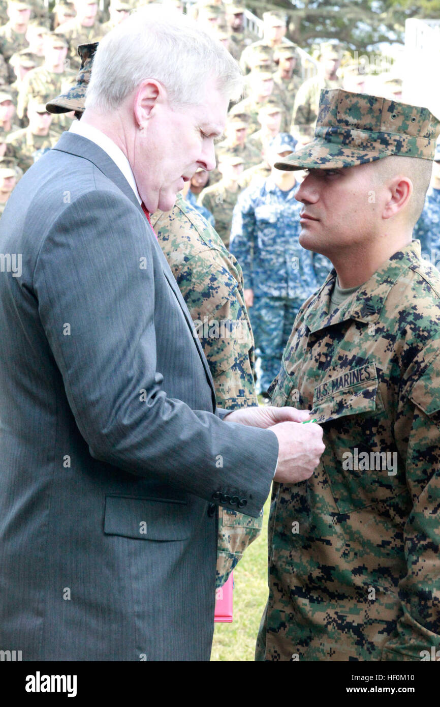 A U.S. Marine receives the Navy and Marine Corps Commendation Medal ...
