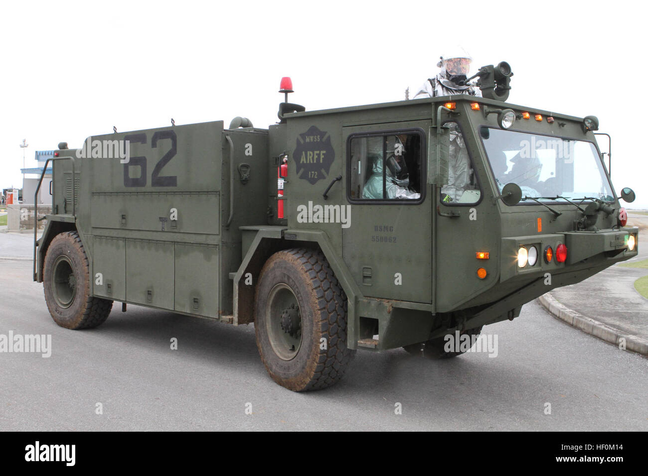 Marines drive a P-19 aircraft rescue firefighting vehicle to a ...