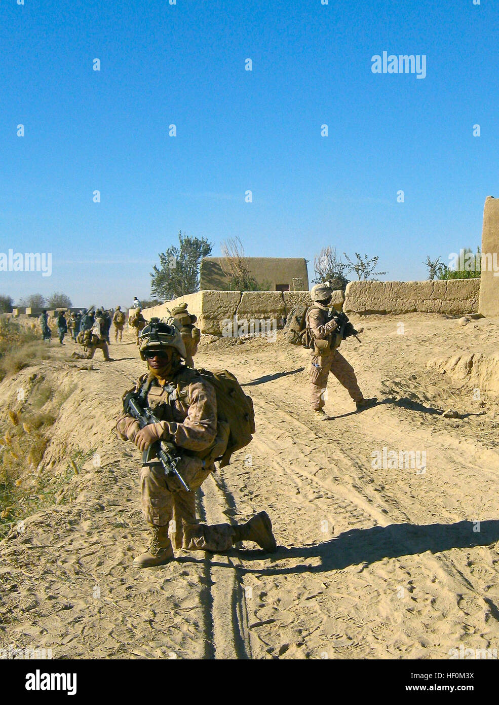 Marines and sailors from Border Advisory Team 2, stand watch outside an ...