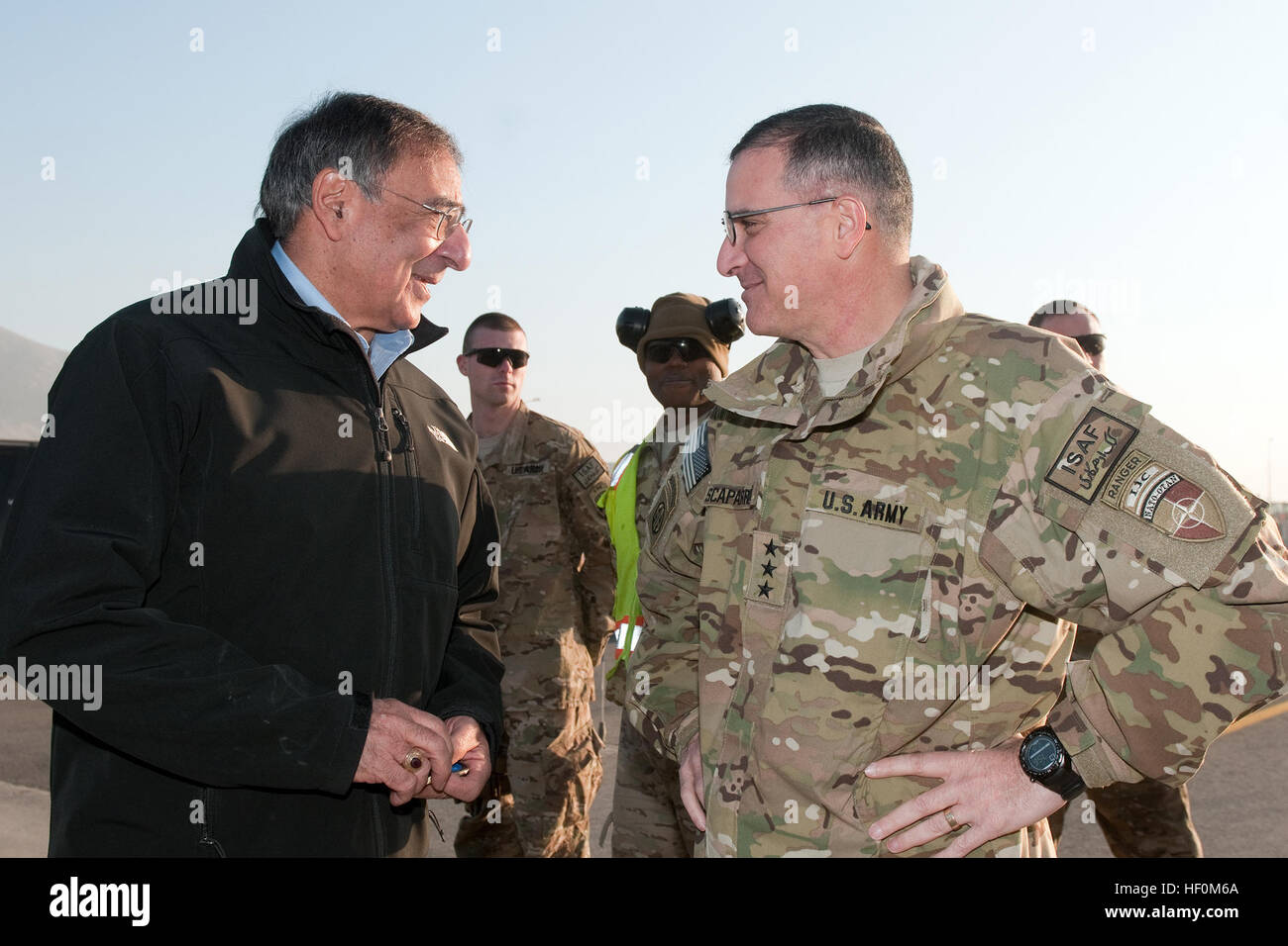 U.S. Secretary of Defense Leon Panetta shares a quiet word with the ...