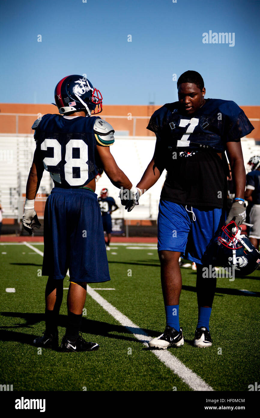 Ryan Dillard, a cornerback from Buford, Ga., gives a high-five to ...